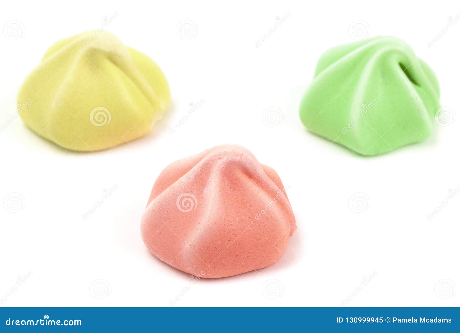 Line of Three Different Colored Meringues on a White Background Stock ...