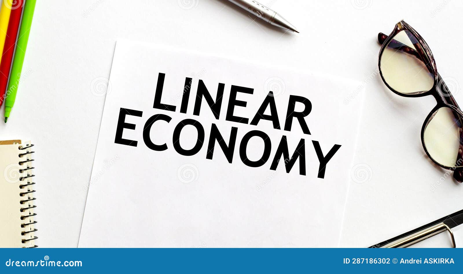 LINEAR ECONOMY on Paper Sheet with Glasses and Pencils Stock Photo ...