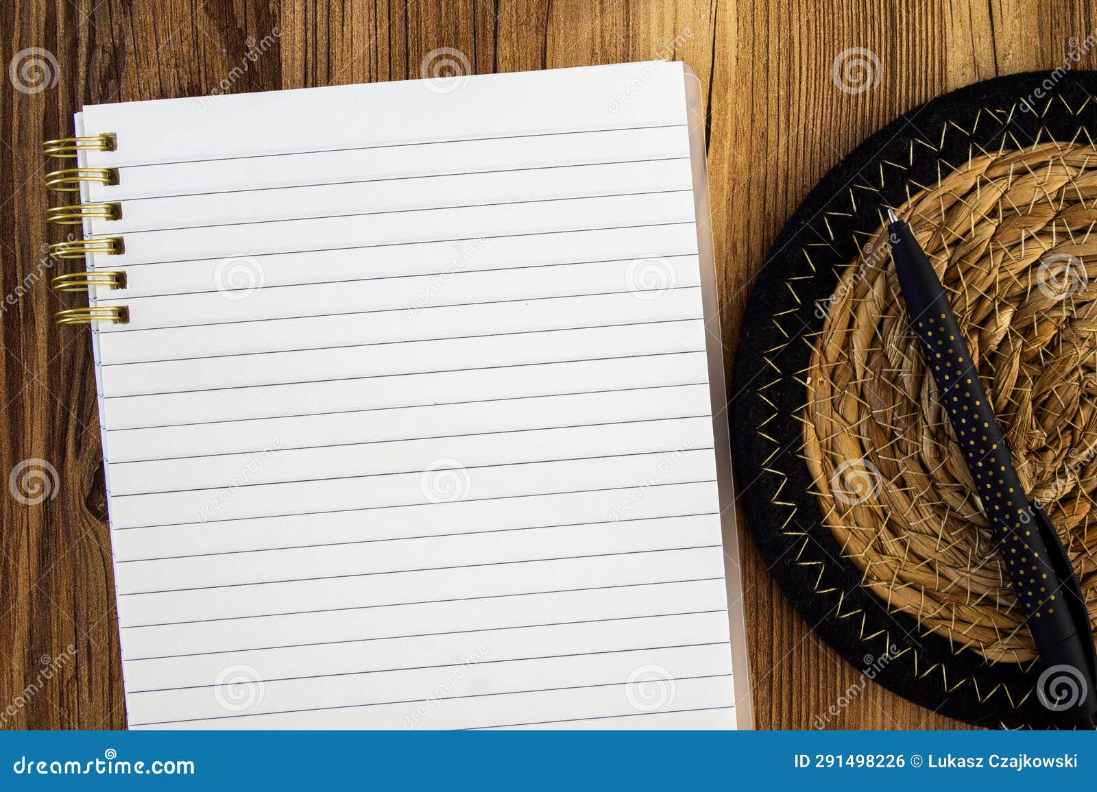 Lined Blank Note Pad Mock Up with a Black Pen on a Straw Mat Stock ...