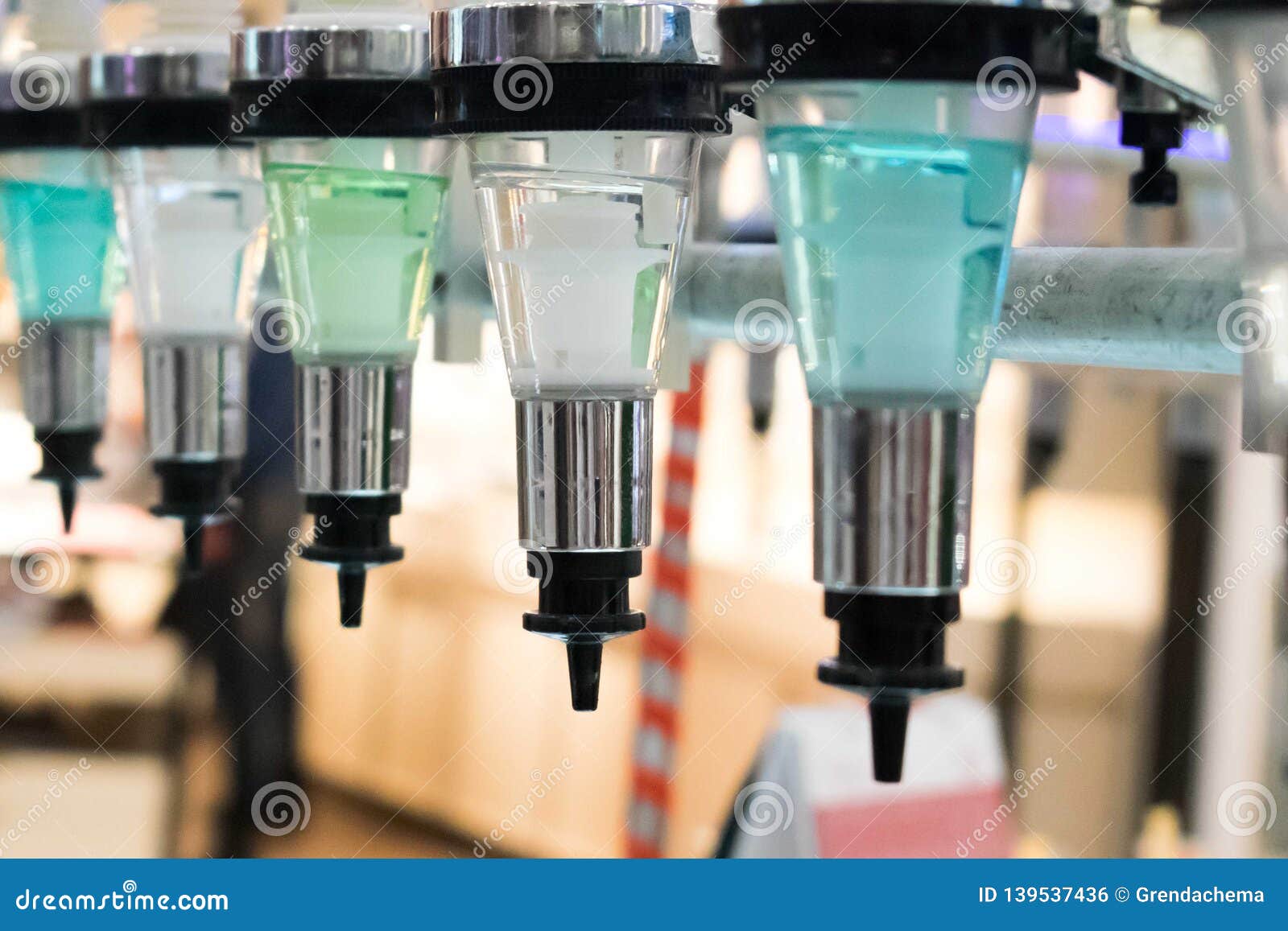 Lined Perfume Containers Upside Down Stock Photo - Image of container ...