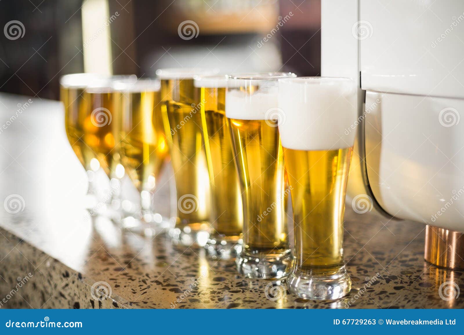 Lined up beers on table stock image. Image of metallic - 67729263
