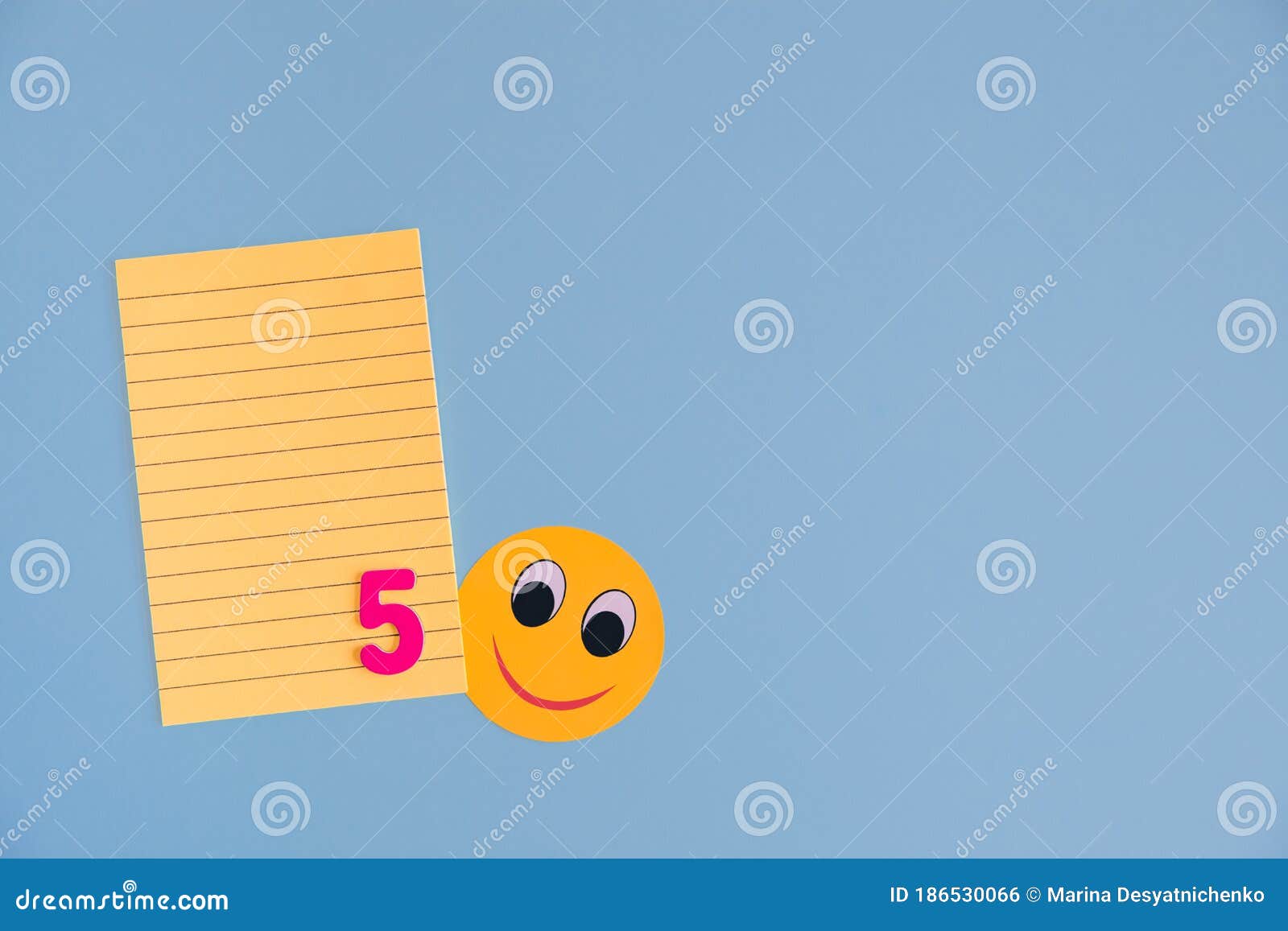 A Lined Yellow Notepad with the Number Five at the Bottom and a Smiling ...