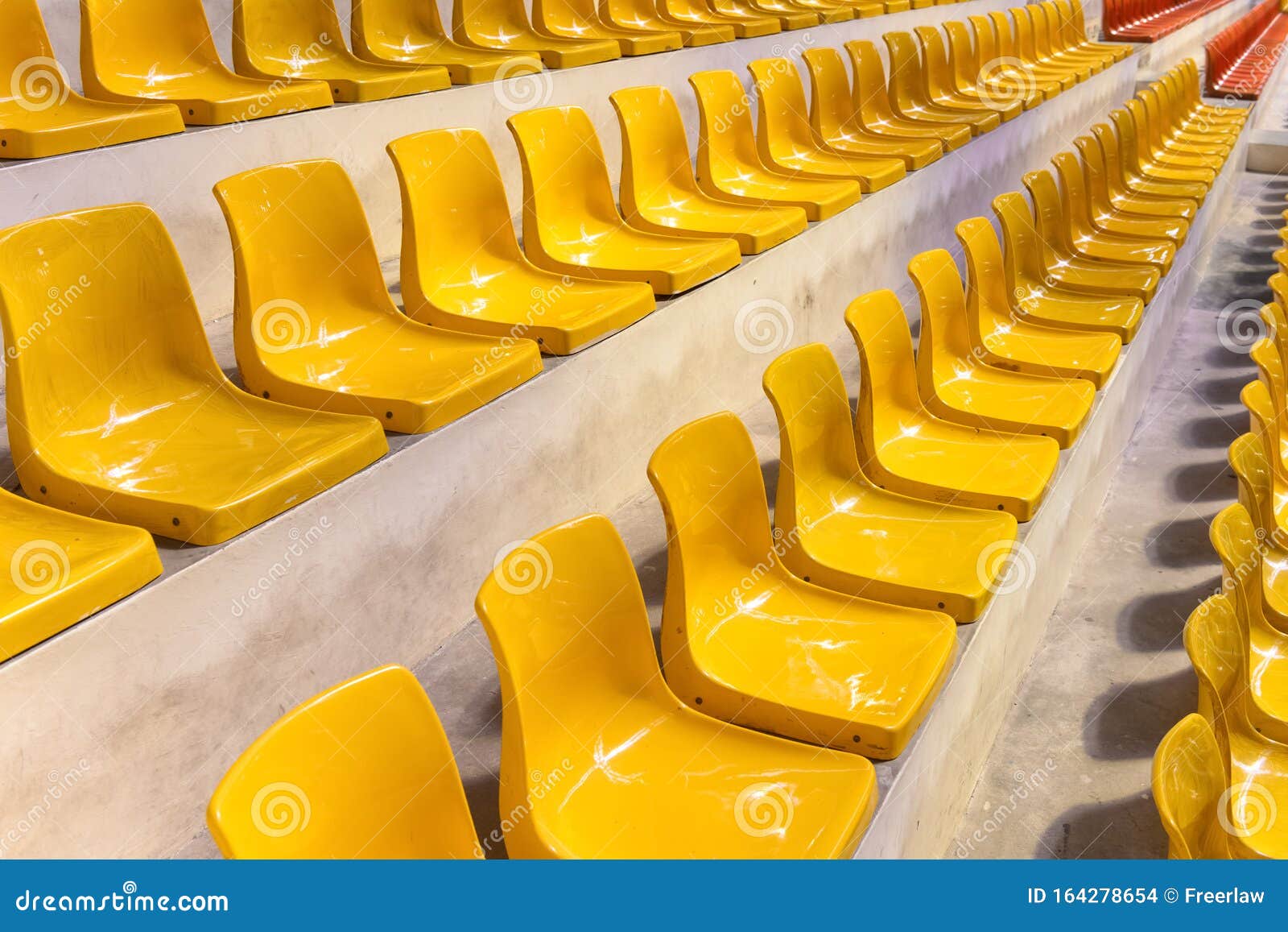 Yellow Stadium Seating In Rows From Behind Royalty-Free Stock Photo ...