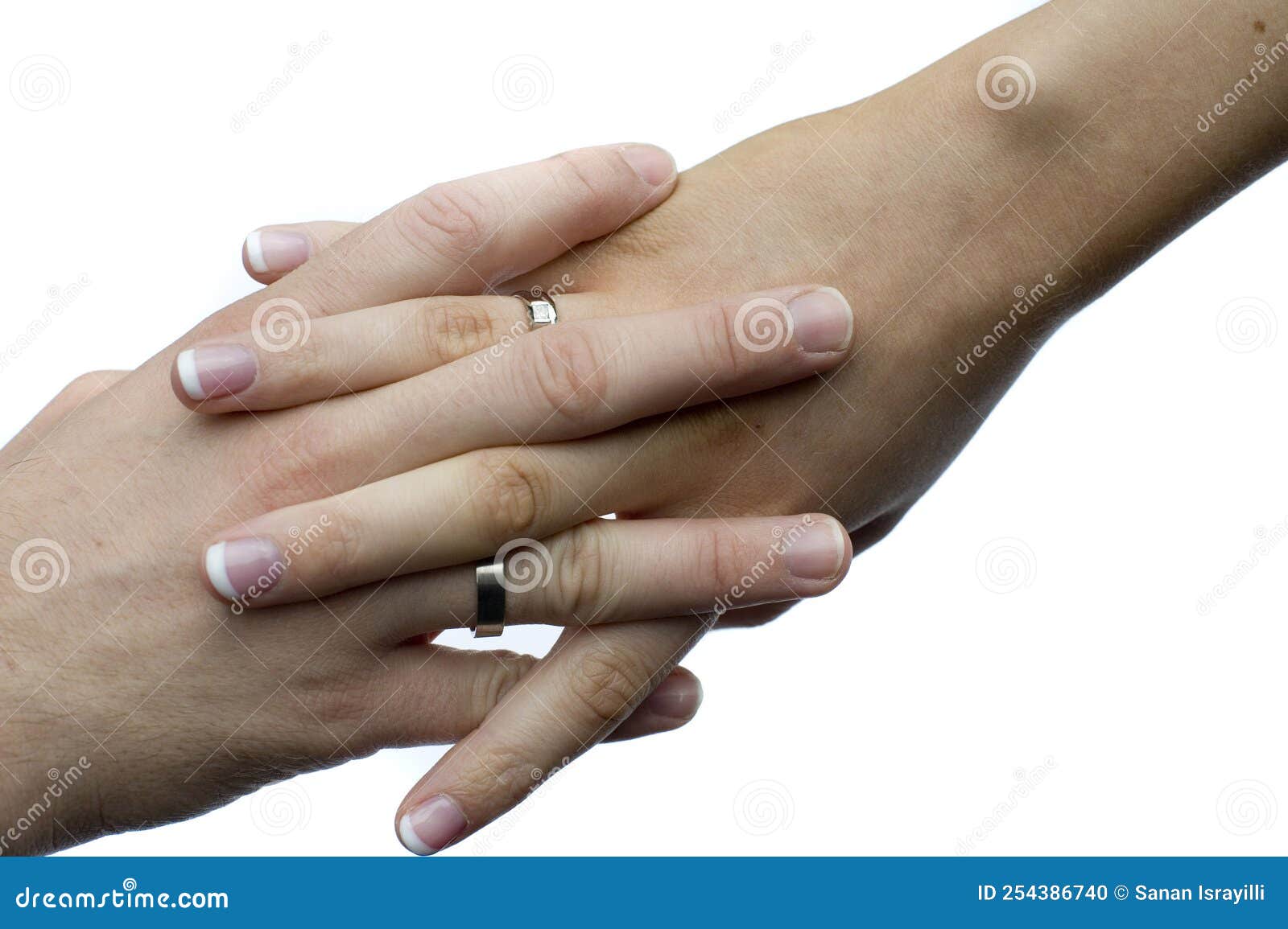 A Romantic Couple Holding Hands with Fingers Linked Together Stock ...
