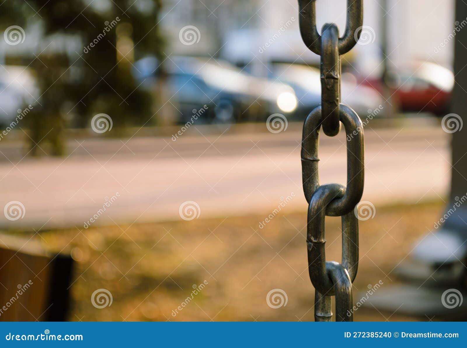 The Links of a Metal Chain Hang Vertically and are Illuminated by the ...