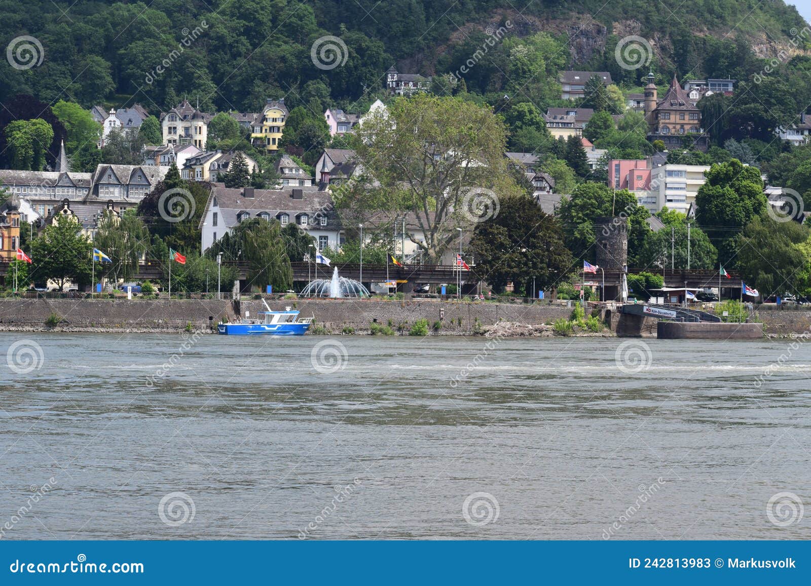 Linz, Germany - 06 09 2021: Waterfront of Linz with a Small Boat at the ... Linz, Germany - 06 09 2021: Waterfront of Linz with a Small Boat at the ...