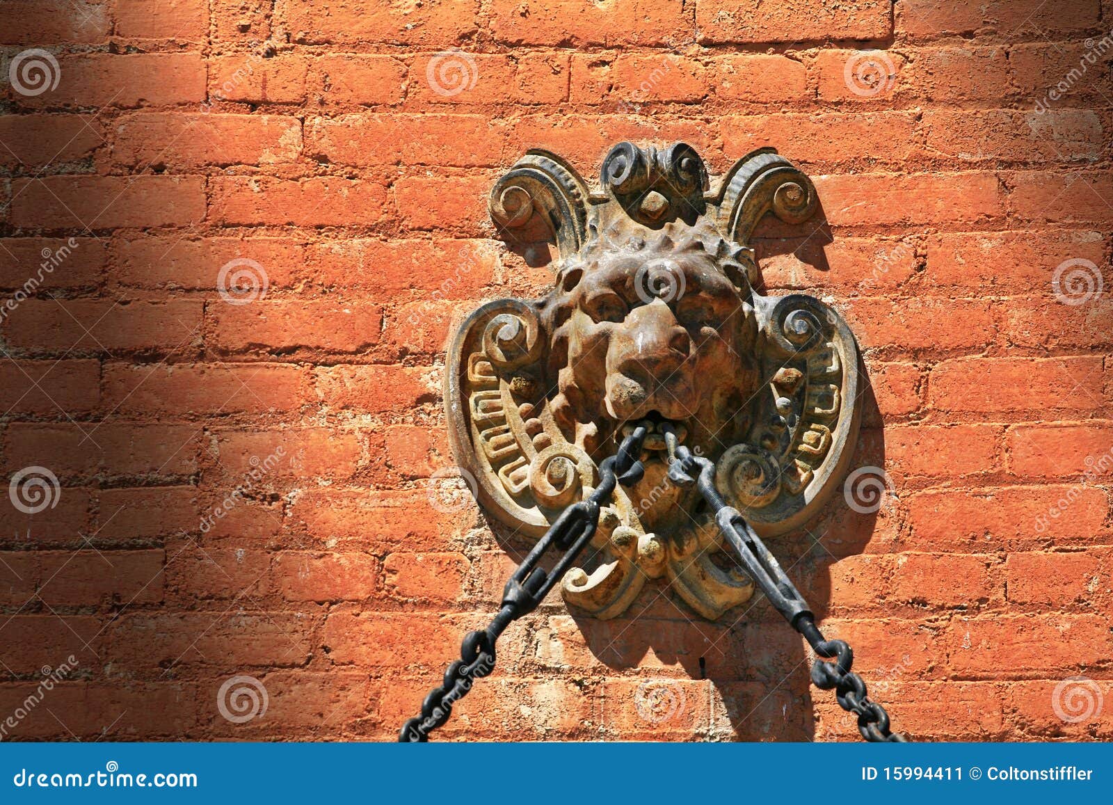 Lion Face Gargoyle with Chain on Brick Wall Stock Image - Image of ...