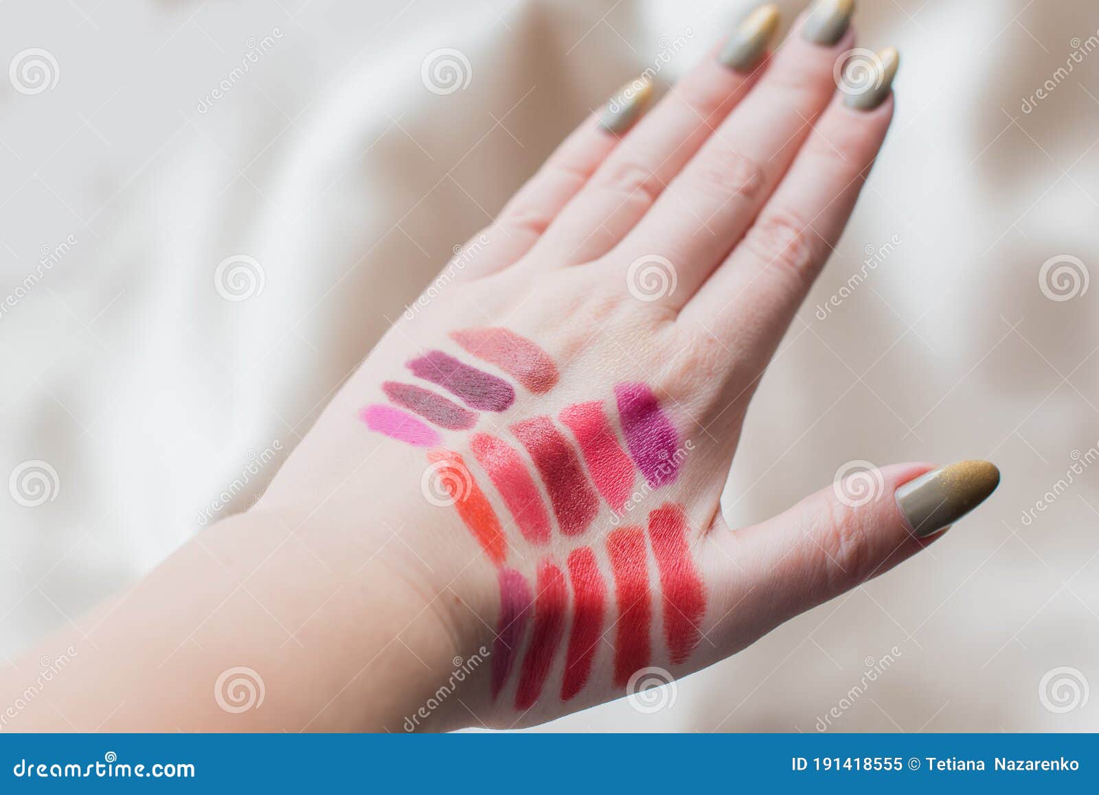 Lipstick colors on a hand stock image. Image of isolated - 191418555