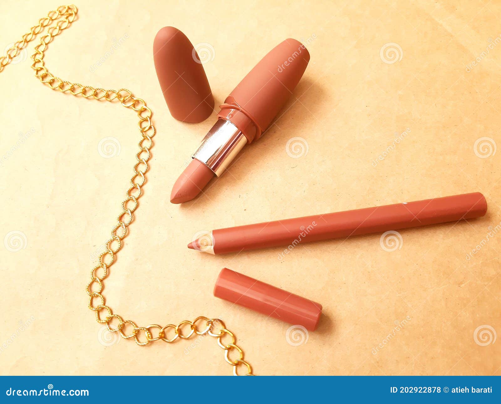 Lipsticks and golden chain stock photo. Image of cosmetics - 202922878