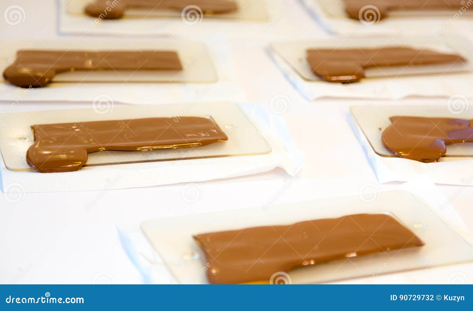 Liquid Chocolate Bars in Forms Ready To Cool in Chcolate Factory Stock ...