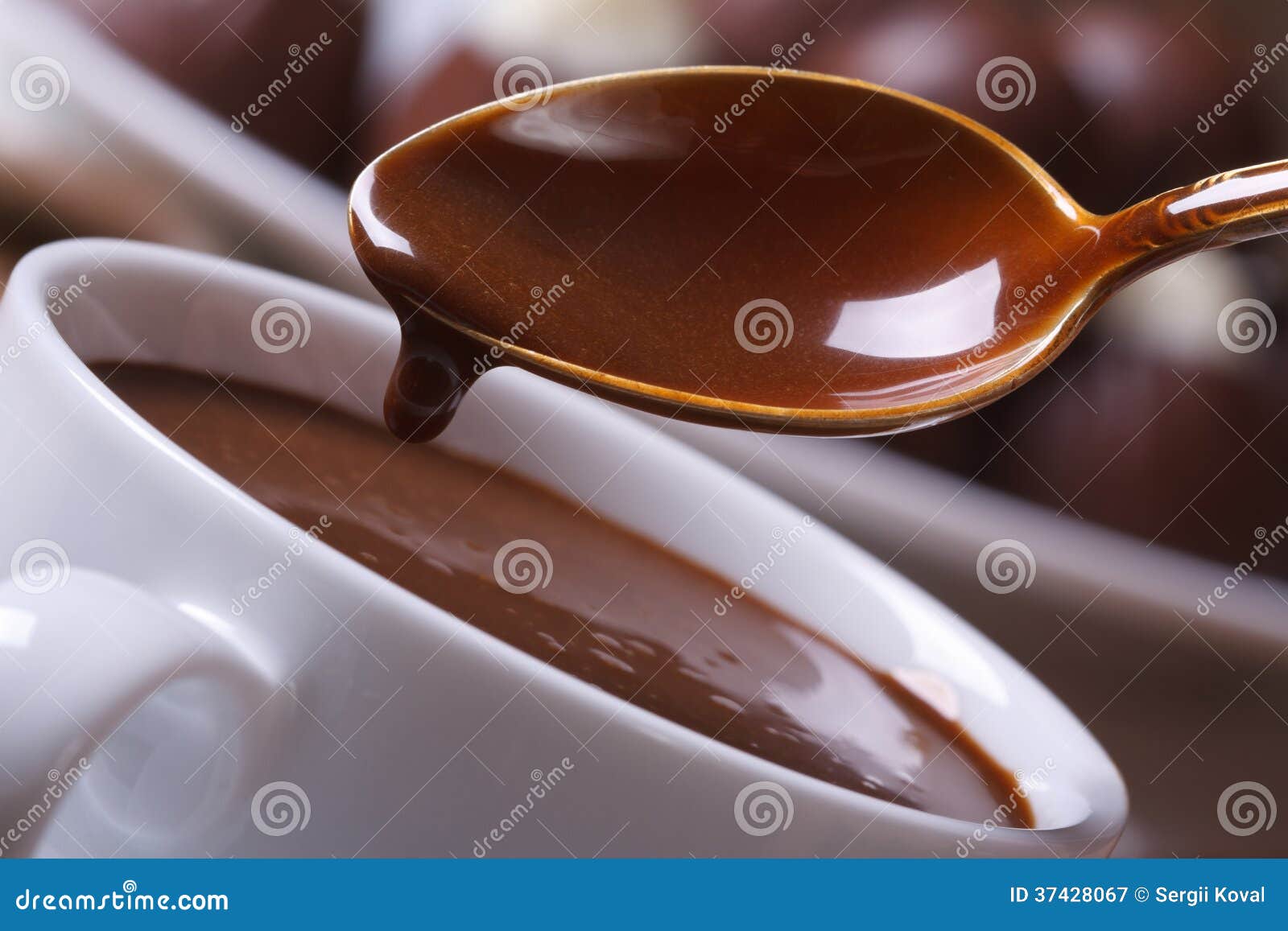 Liquid Chocolate Dripping from the Spoon in a Cup Stock Image - Image ...