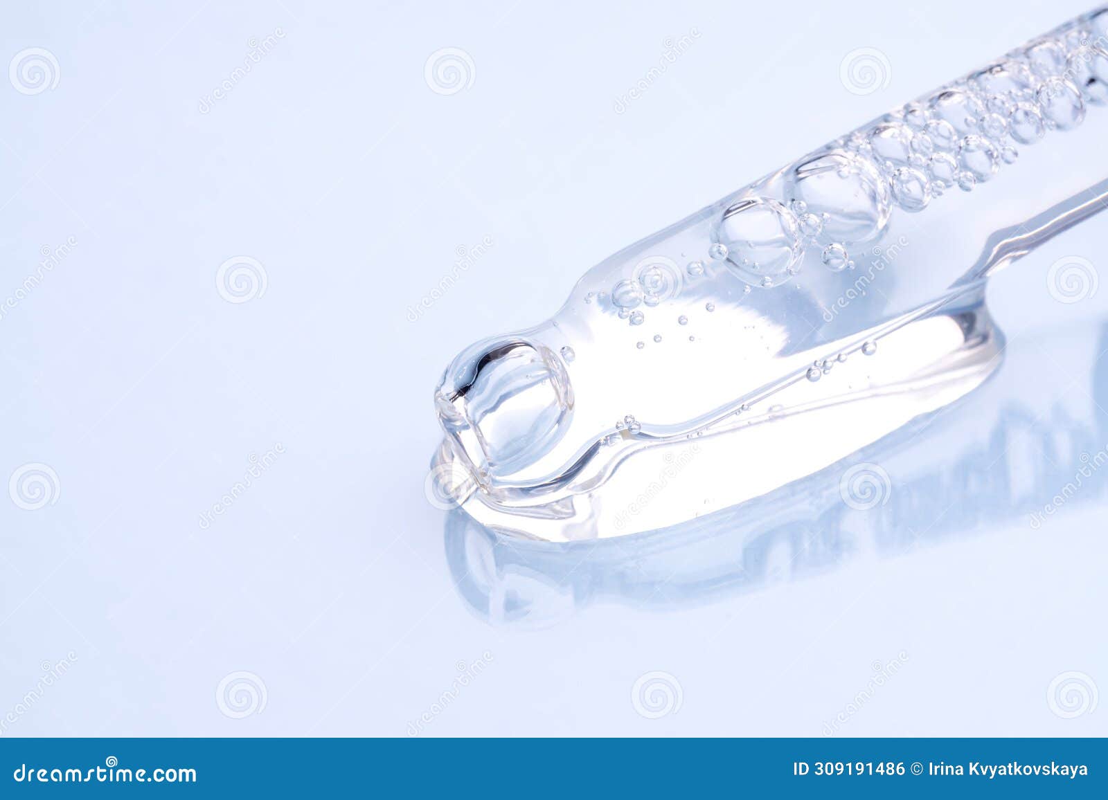 Liquid Cool Blue Gel or Serum on Blue Glass of Microscope Background ...