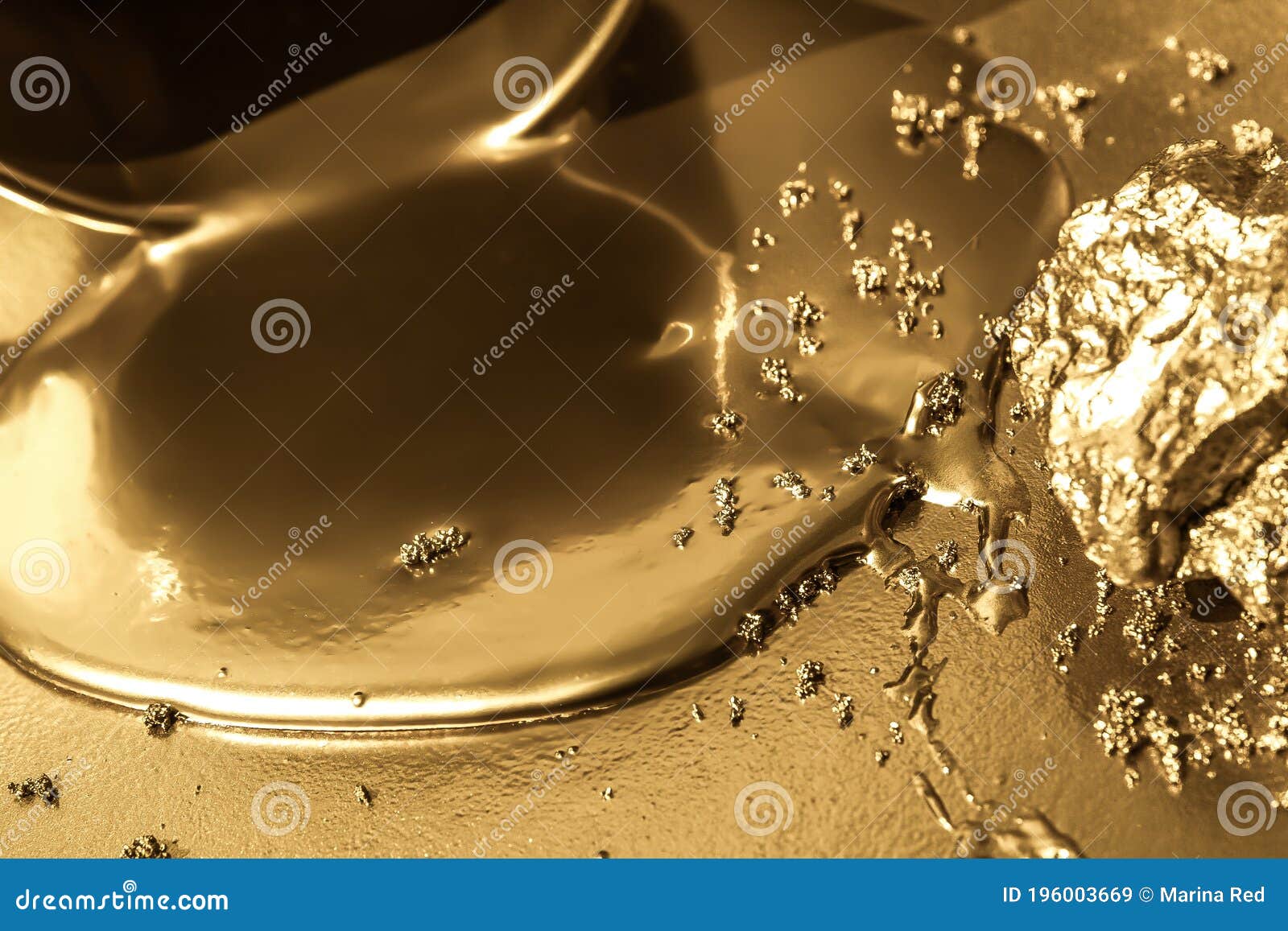 Liquid gold and gold dust. stock image. Image of beauty - 196003669