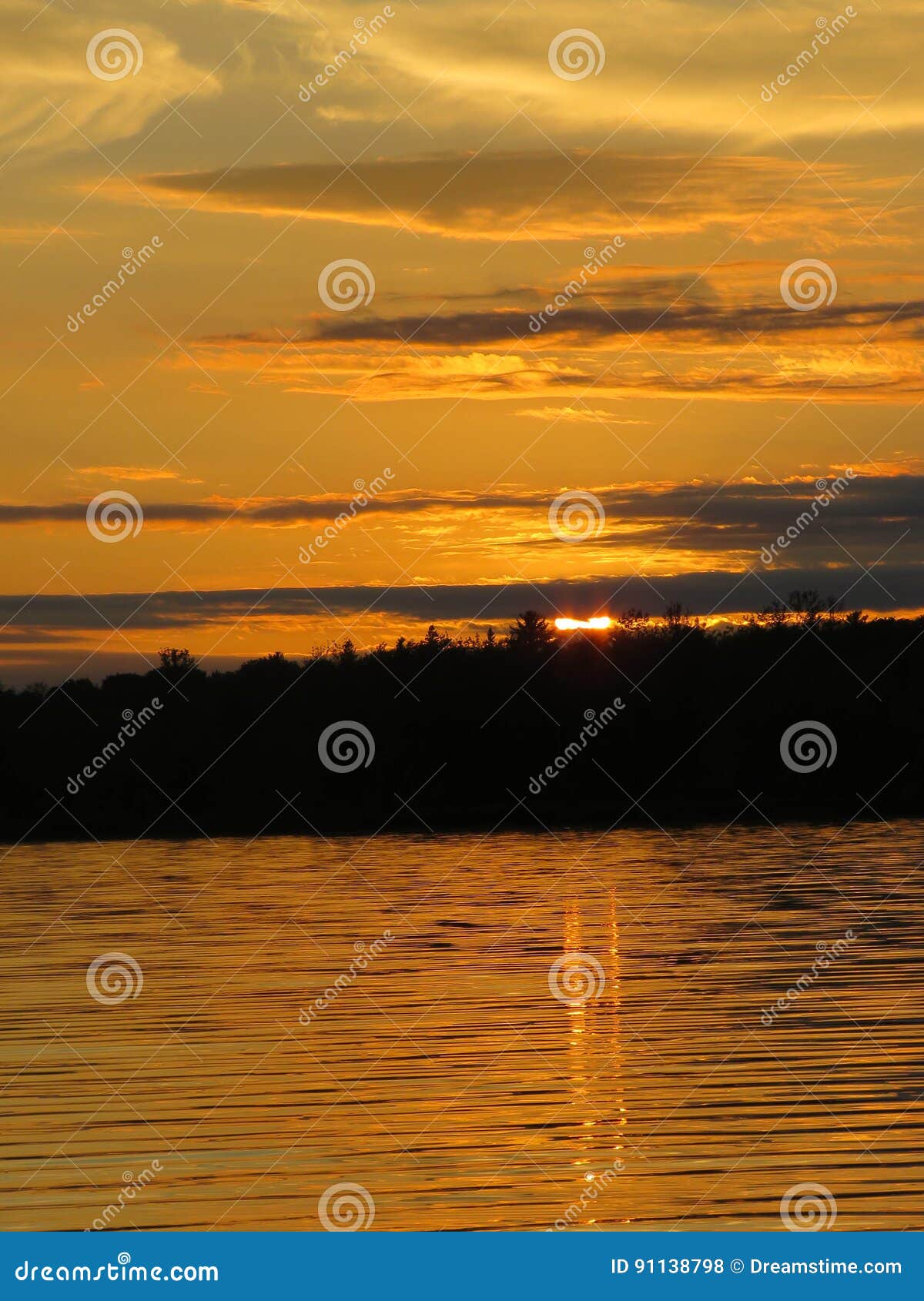 Liquid gold sunset stock photo. Image of reflected, water - 91138798