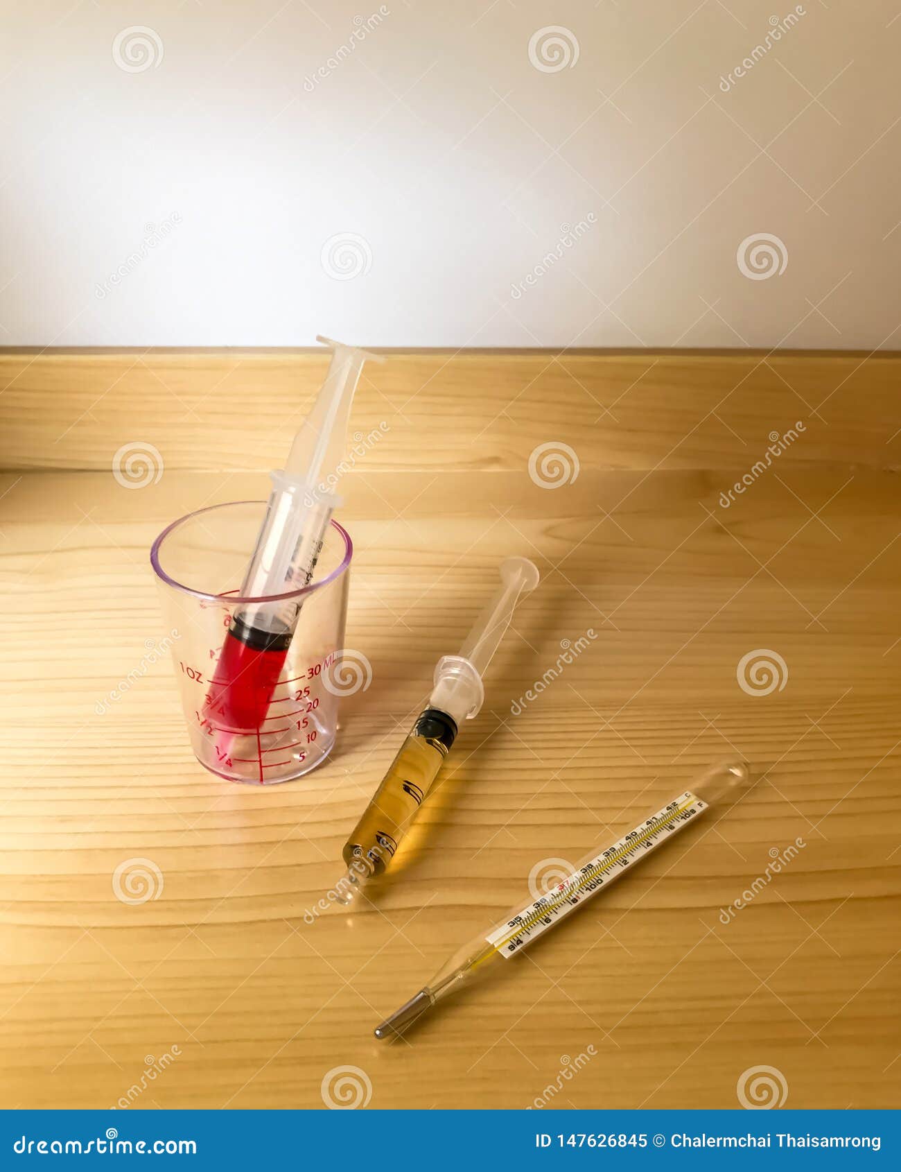 Liquid Medicine with Syringes for Children with the Flu.Thermometer ...