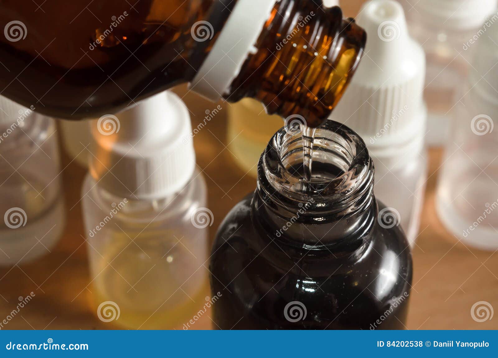 Liquid Mixing for Vape on Wooden Table, Close Up Stock Photo - Image of ...
