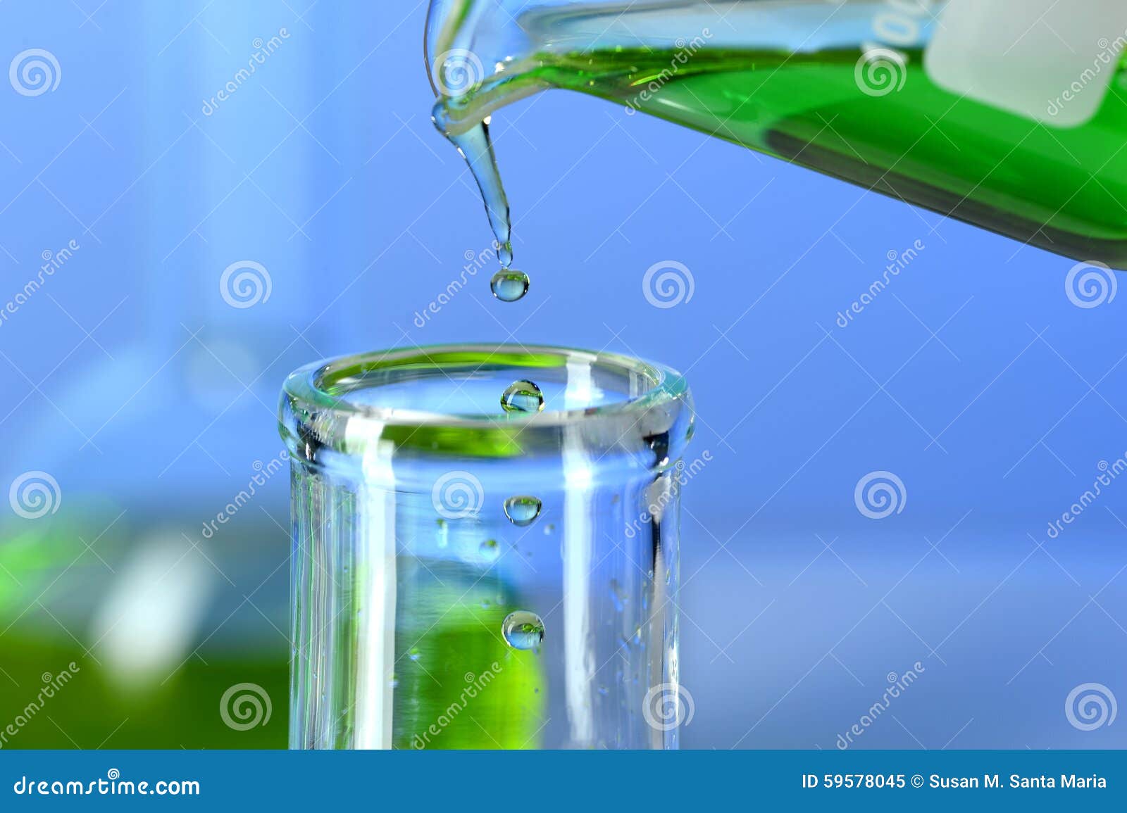 Liquid Pouring from Flask into Test Tube Stock Image - Image of ...