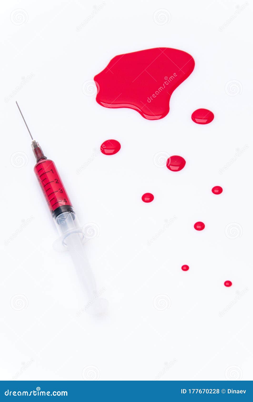 Medical Syringe with Red Blood on a White Background Surrounded by ...
