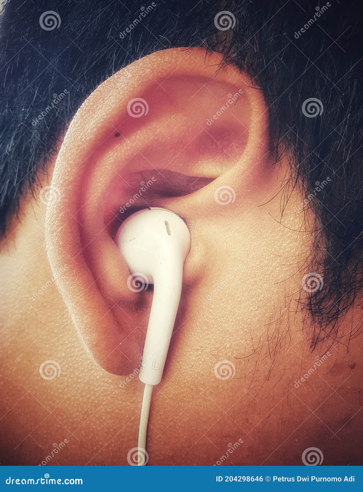 Listening with earphone stock photo. Image of technology - 204298646