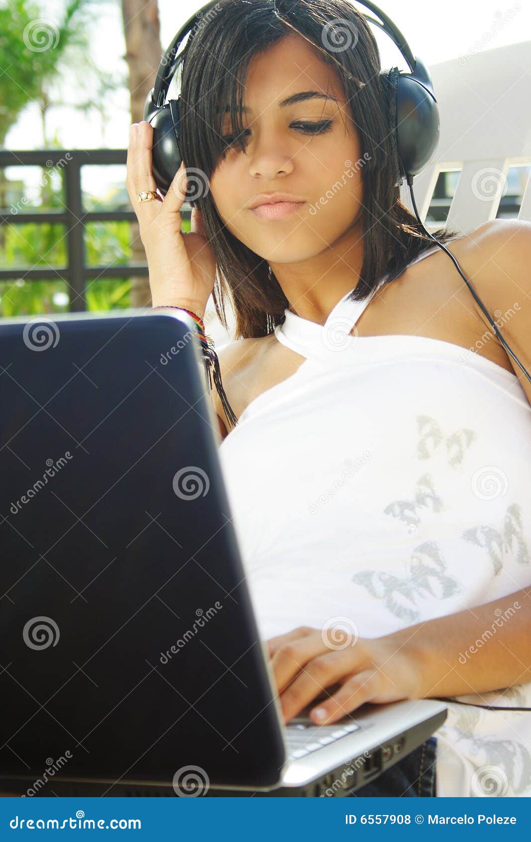 Listening music on laptop stock photo. Image of latin - 6557908