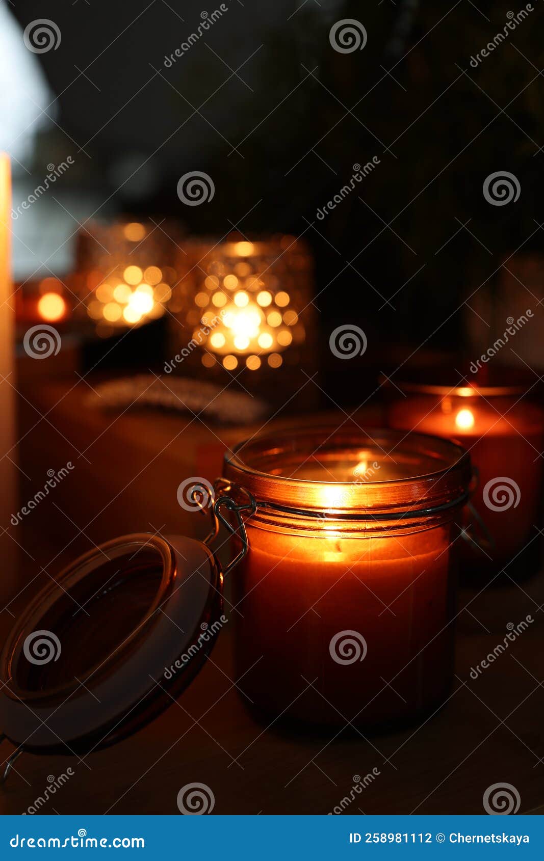 Lit Candles on Wooden Table in Dark Room. Space for Text Stock Photo ...