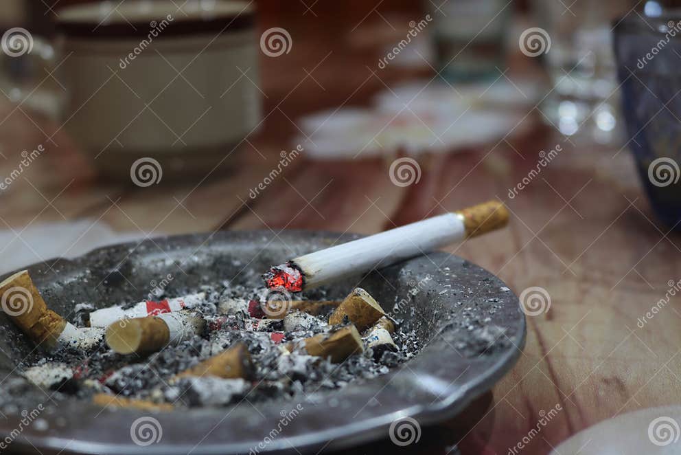Lit Cigarettes and Cigarette Marks Stock Photo - Image of marks, danger ...
