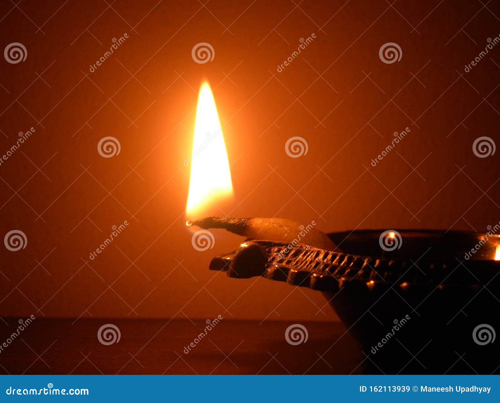 Lit Diya oil lamp in dark stock image. Image of decorative - 162113939