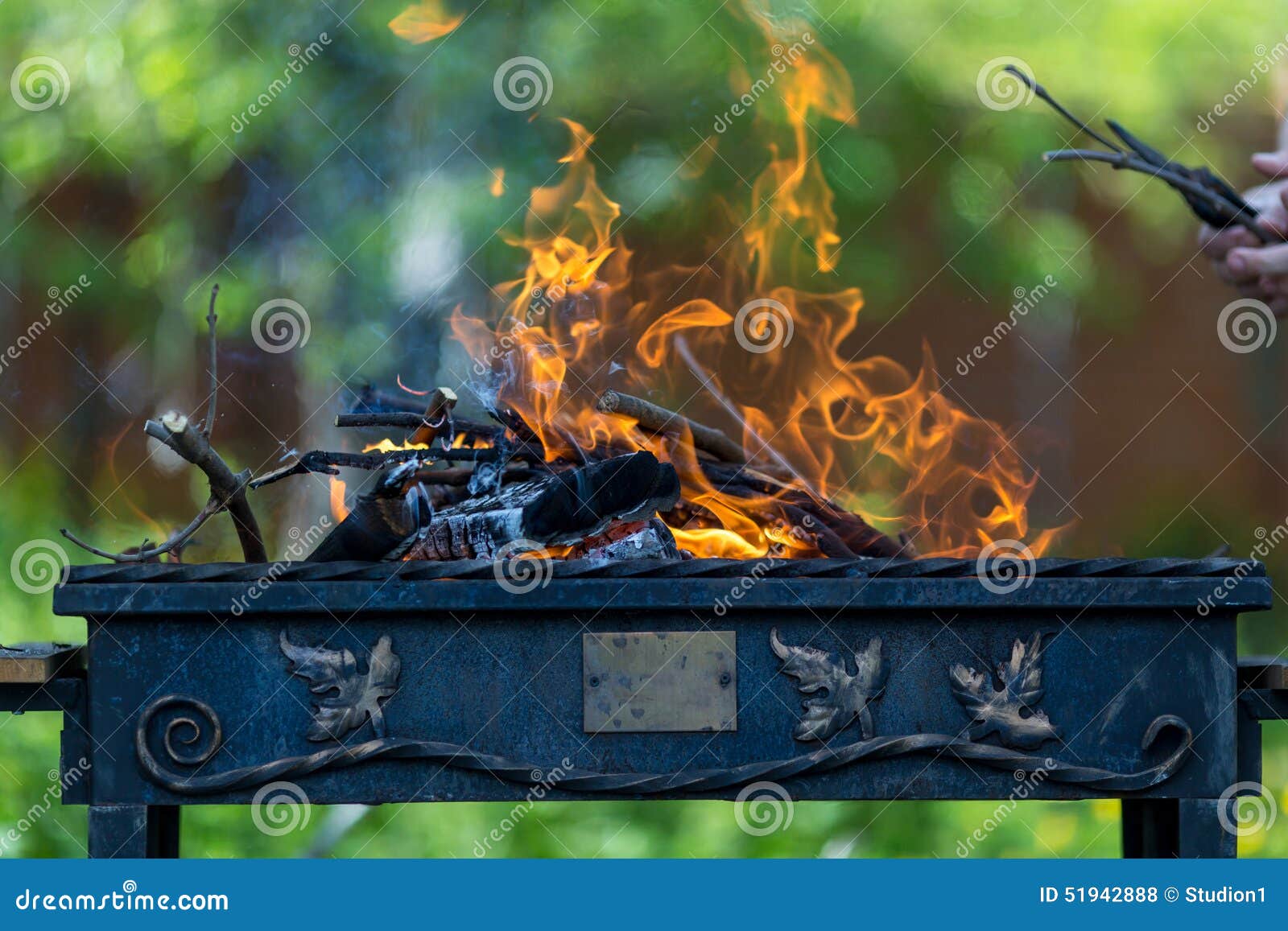 Lit a fire in the grill stock photo. Image of flame, fire - 51942888