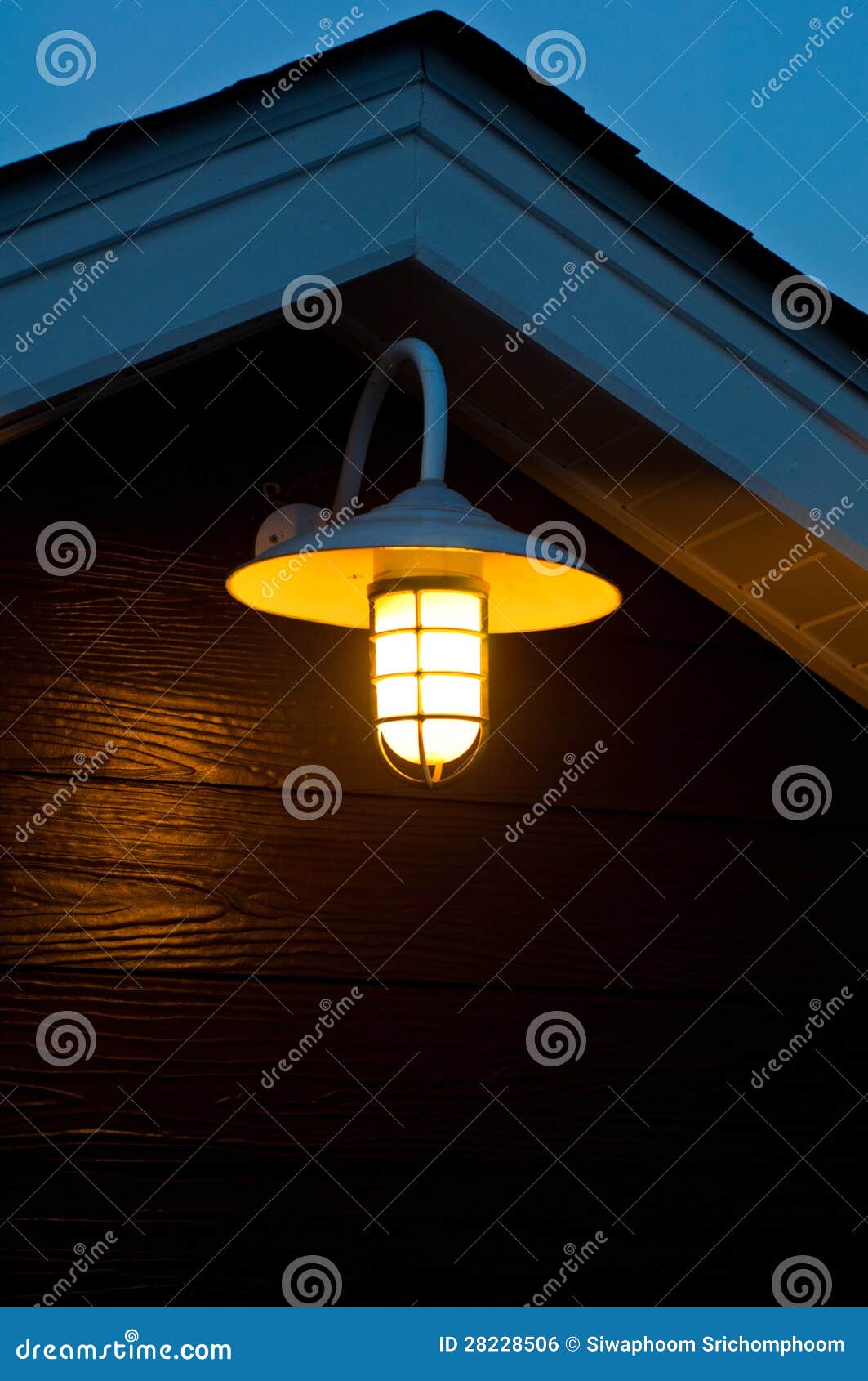 Lit Lamp Post Against a Textured Wooden Wall Stock Photo - Image of ...