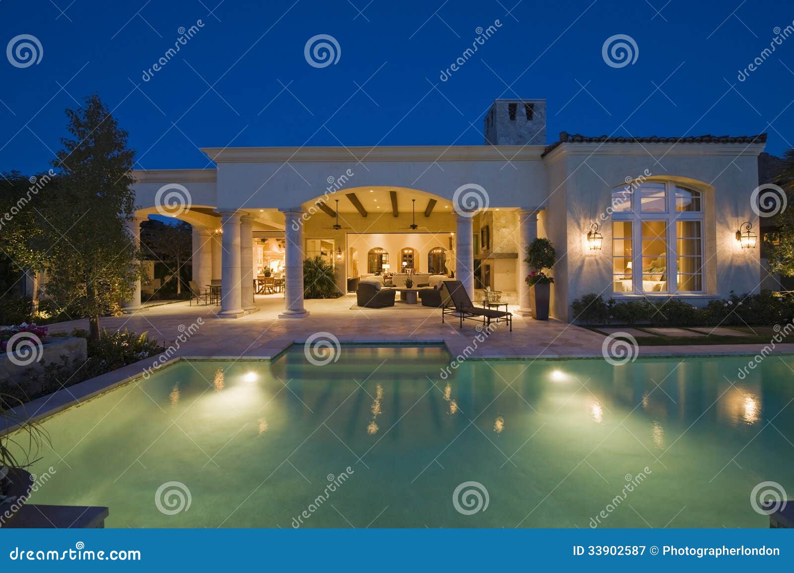 Lit Swimming Pool and Building Exterior Stock Image - Image of built ...