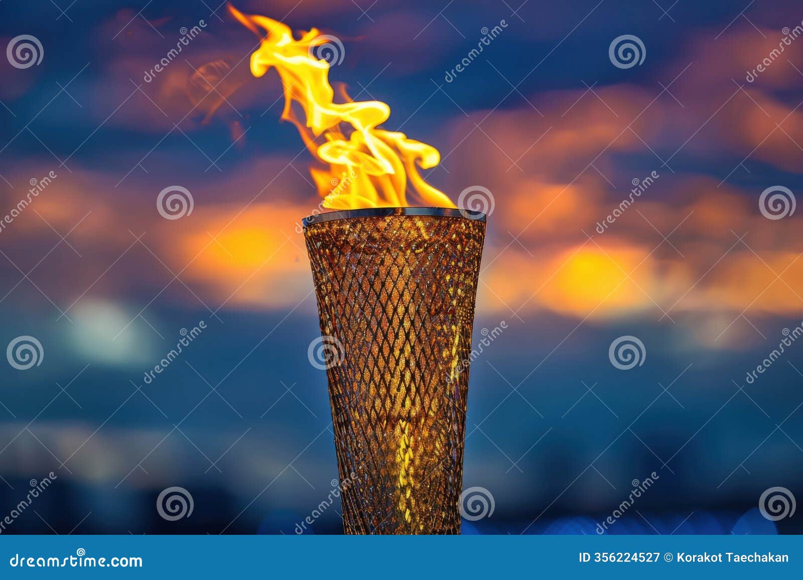 A Lit Torch is in the Foreground of a Sunset Stock Image - Image of ...