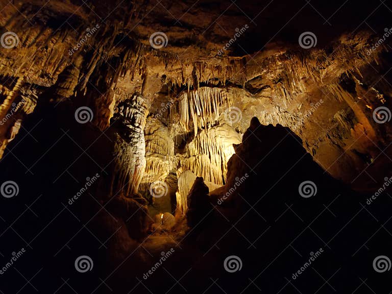 Lit up cave formations stock image. Image of underground - 149984249