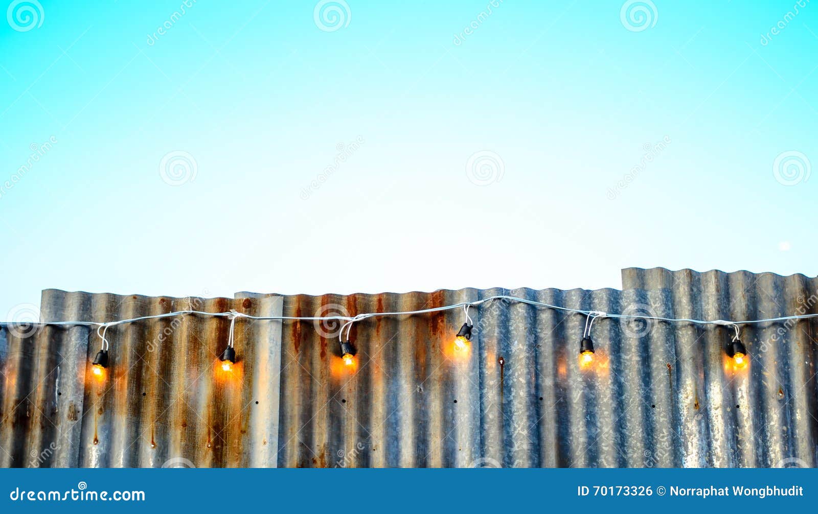 Lit Zinc Fence stock photo. Image of blue, industrial - 70173326