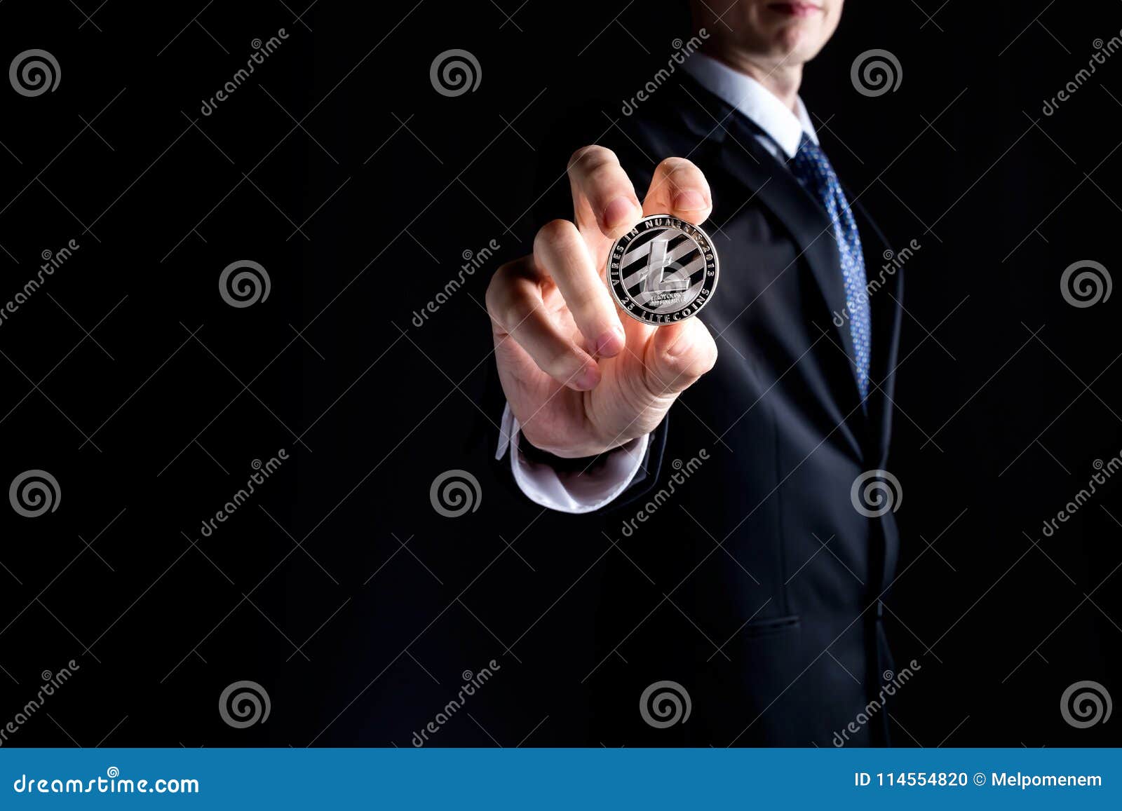 Litecoin Coin Held Out by a Man in a Suit Stock Photo - Image of black ...
