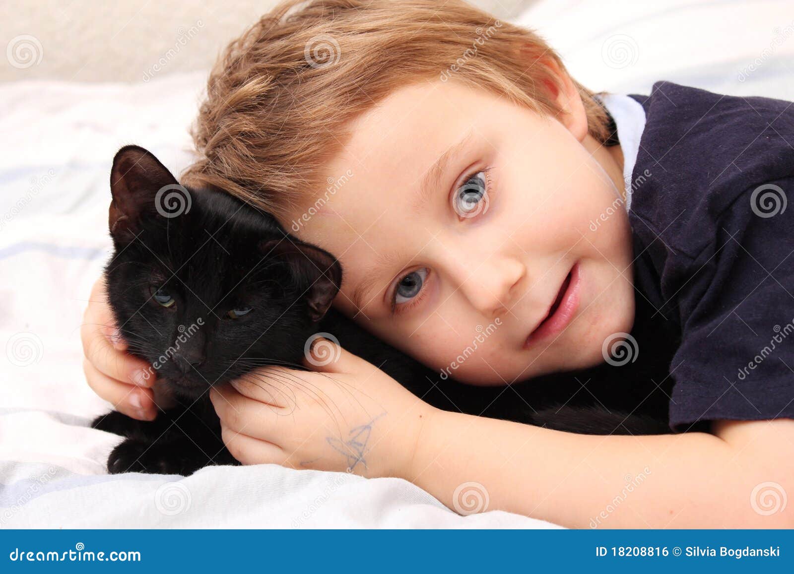 Littel boy with a cat stock photo. Image of cheerful - 18208816