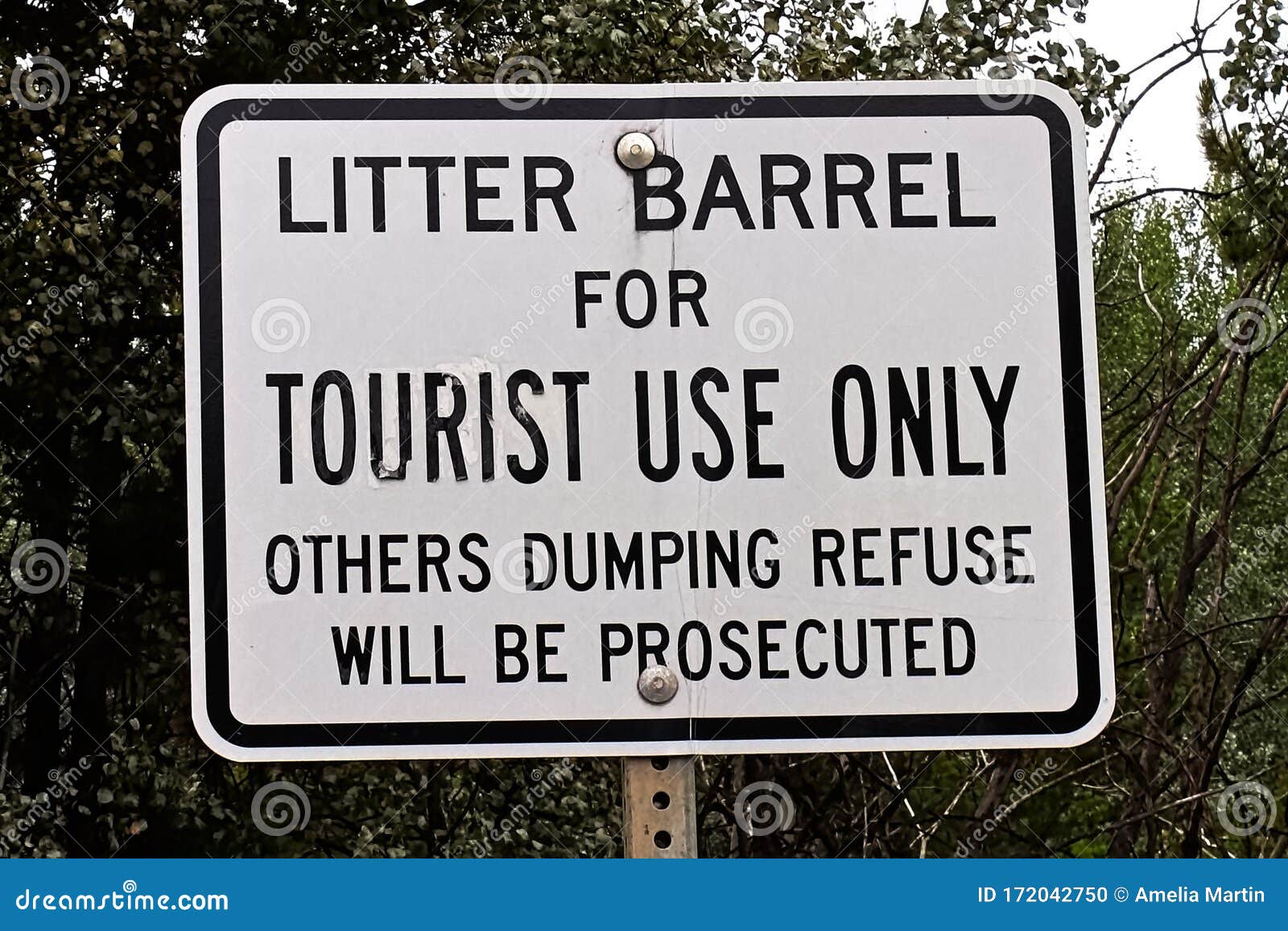 A Litter Barrel for Tourist Use only Sign Stock Photo - Image of ...