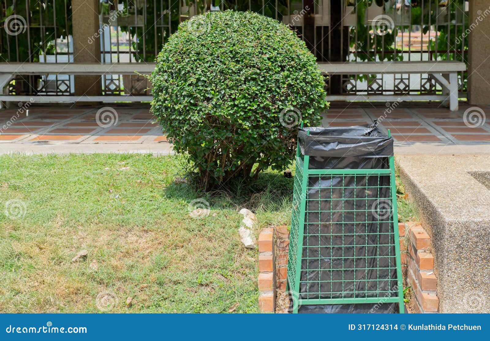 A Litter Bin in a Park on the Grass. Public Rubbish Bin in a Park Stock ...