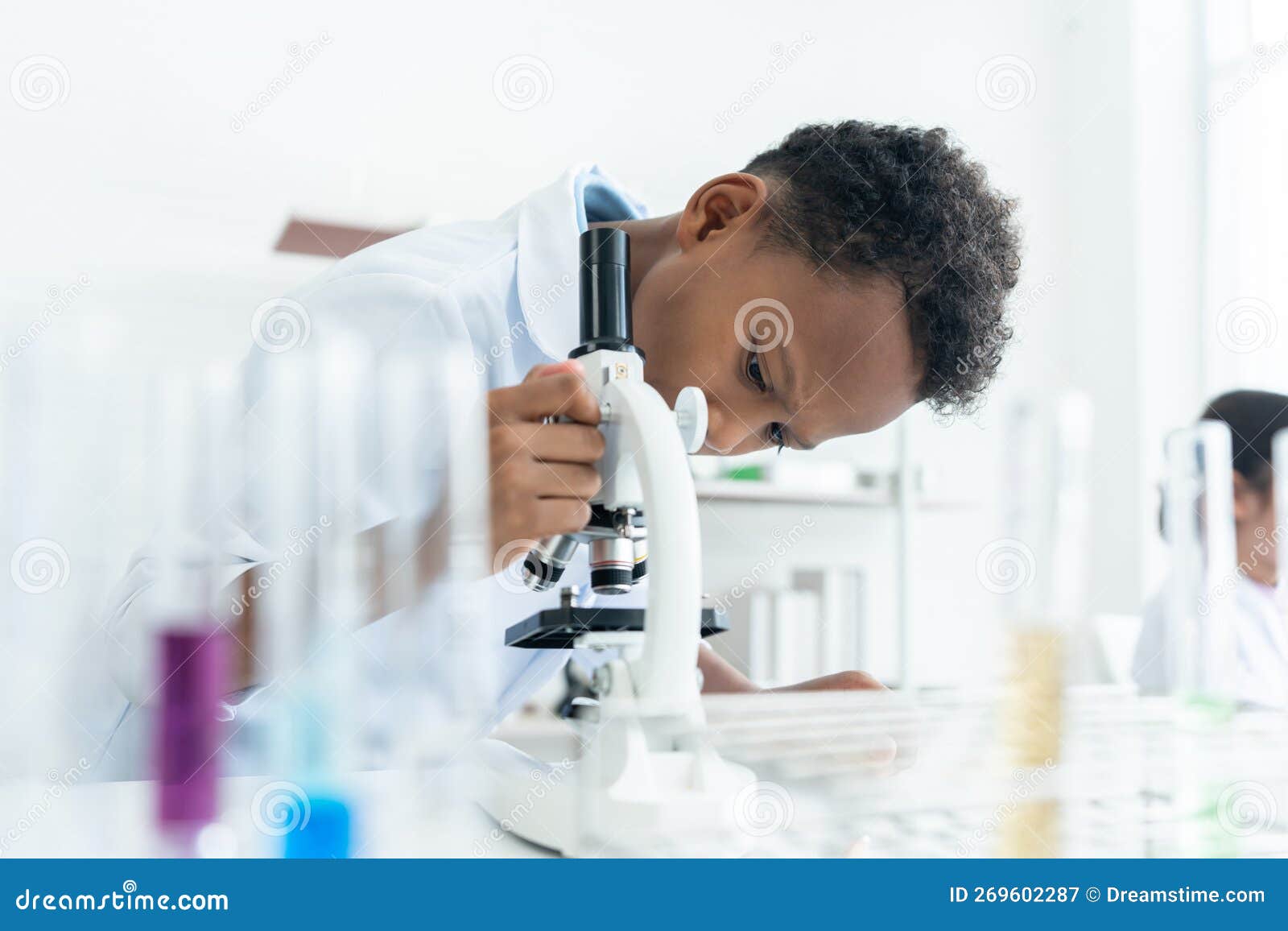 Little African Boy is Paying Attention To the Microscope in the Science ...