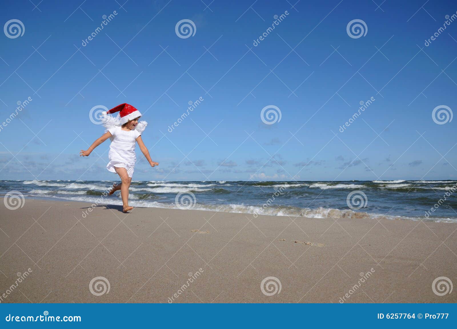 Little angel on the beach stock photo. Image of outside - 6257764