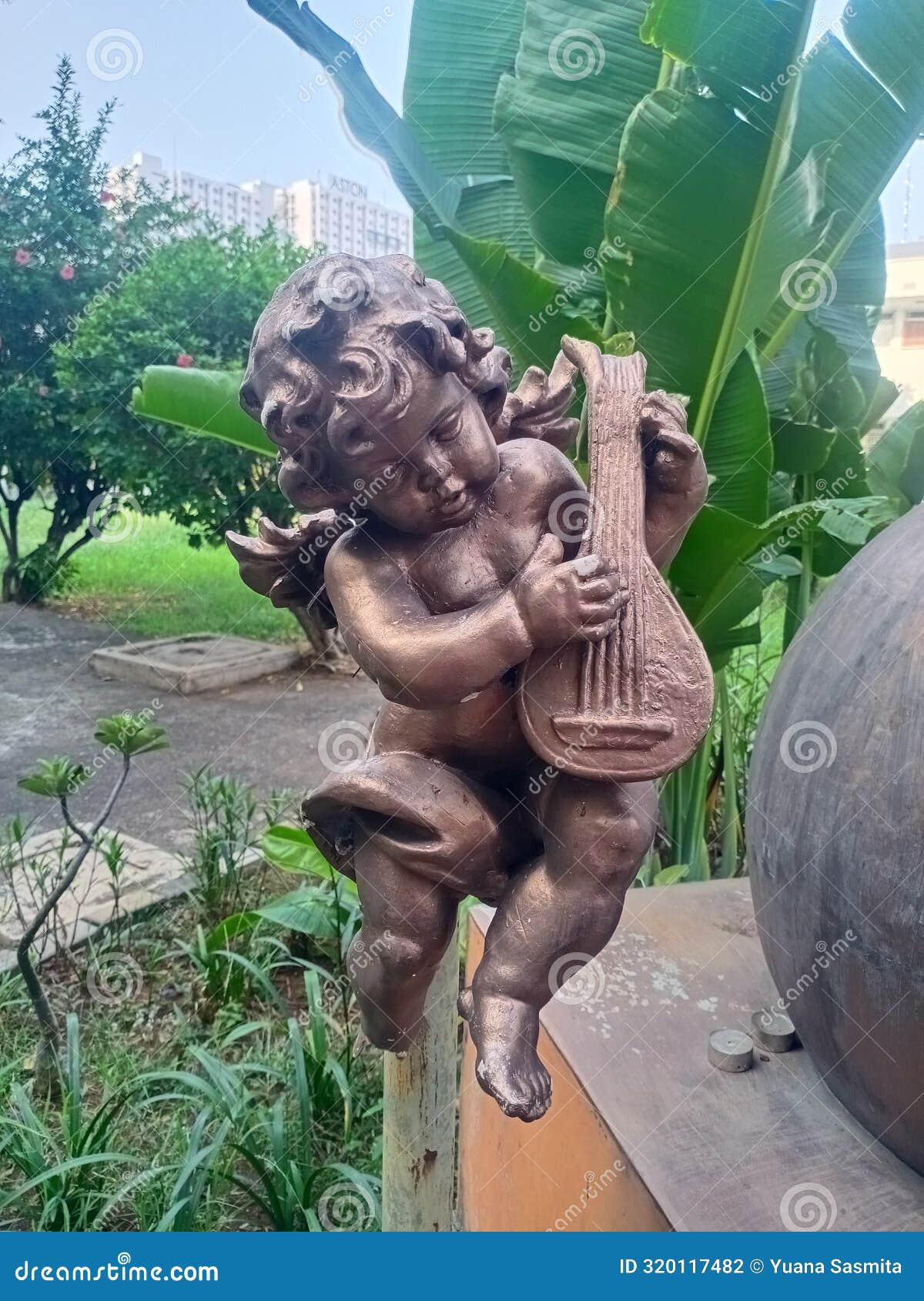 Little Angel Statue Playing Music. a Work of Art of Great Value ...