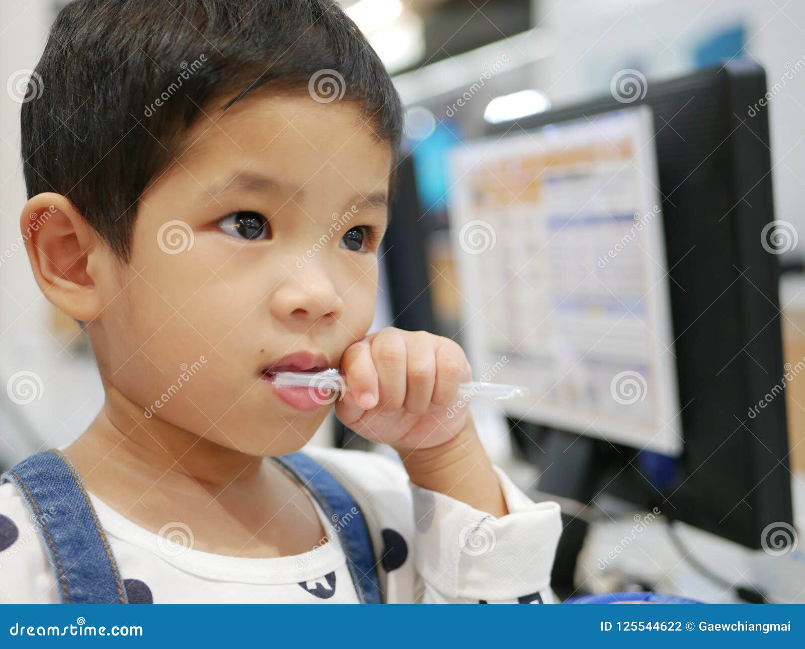 Little Asian Baby Taking a Straw Out from Its Package by Using Her ...