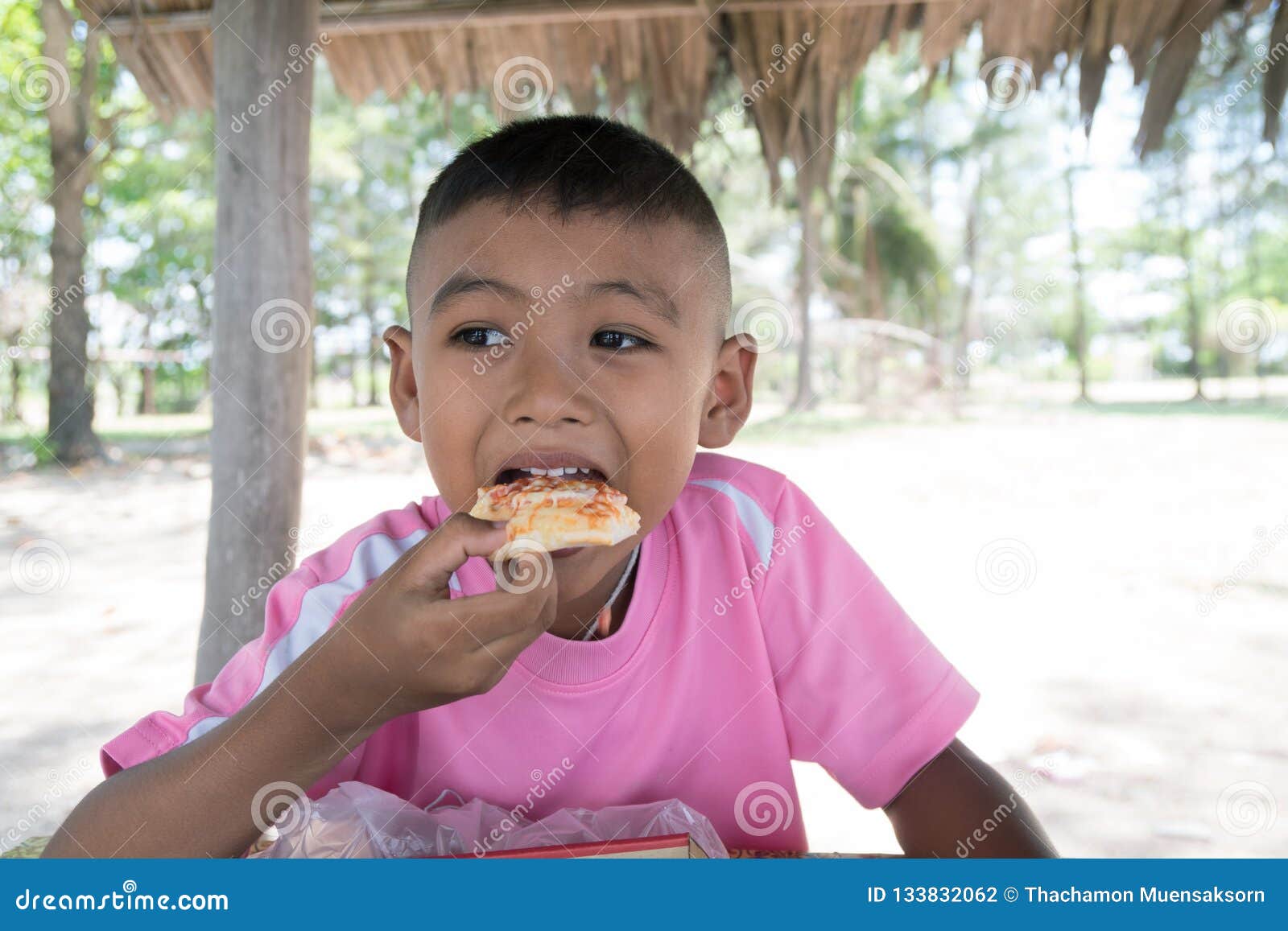 Cute Little Asian Boy Eating Snack Stock Photo - Image of baby, dinner ...