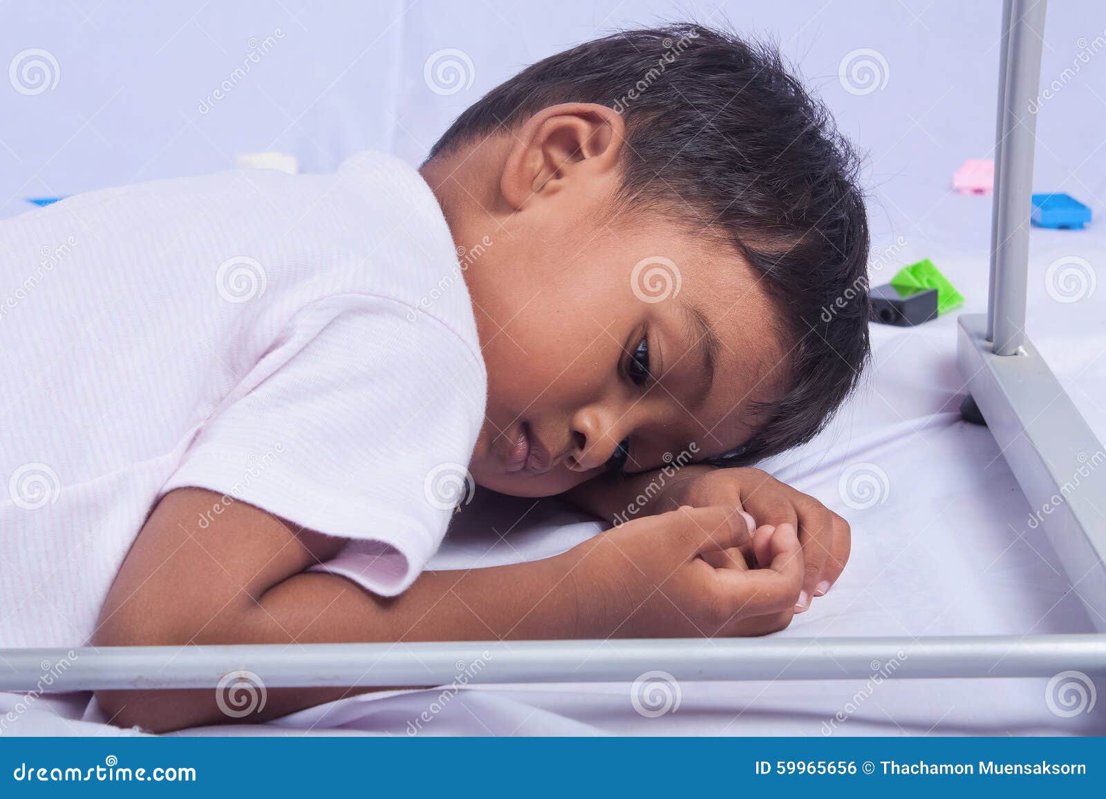 A Little Asian Boy Lying Under the Table Stock Photo - Image of smiling ...