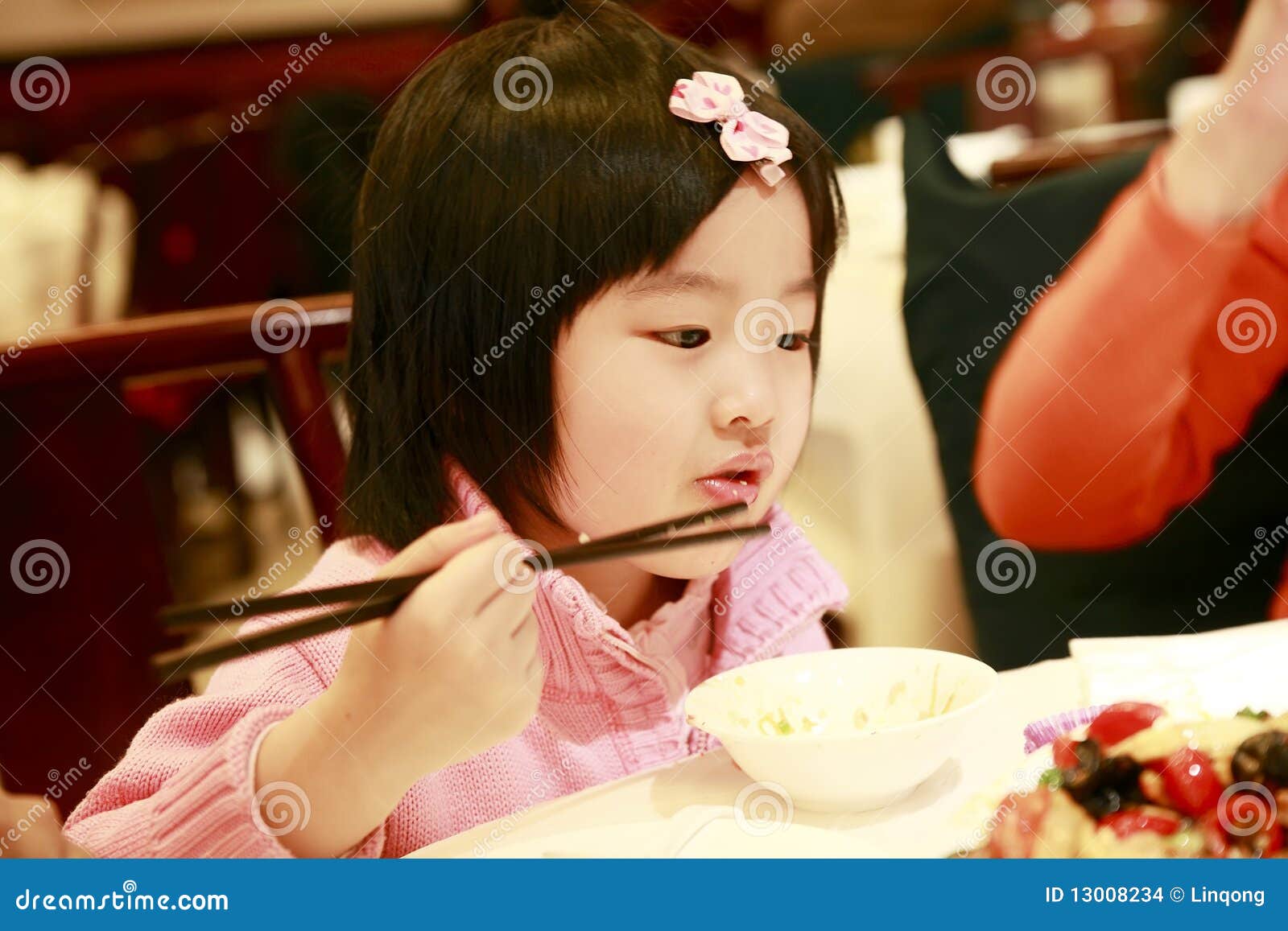 Little asian girl eating stock photo. Image of hold, daughter - 13008234