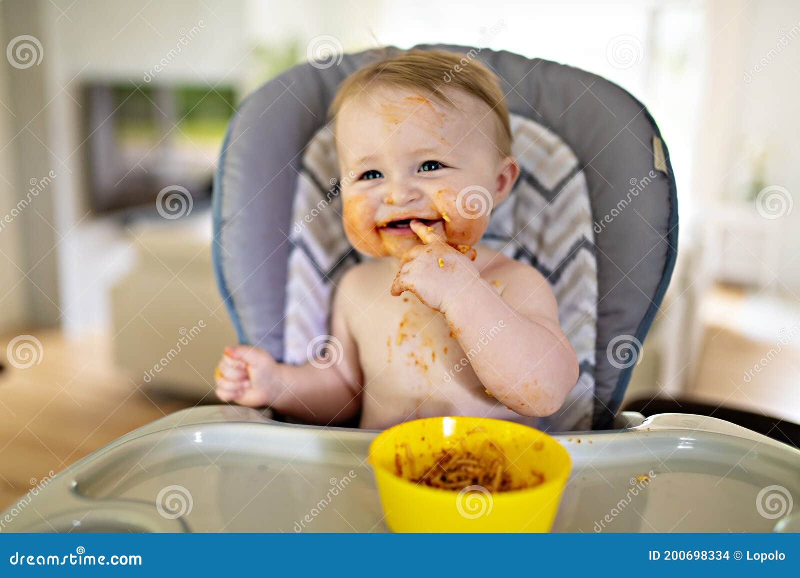 A Little Baby Eating Her Dinner and Making a Mess Stock Photo - Image ...