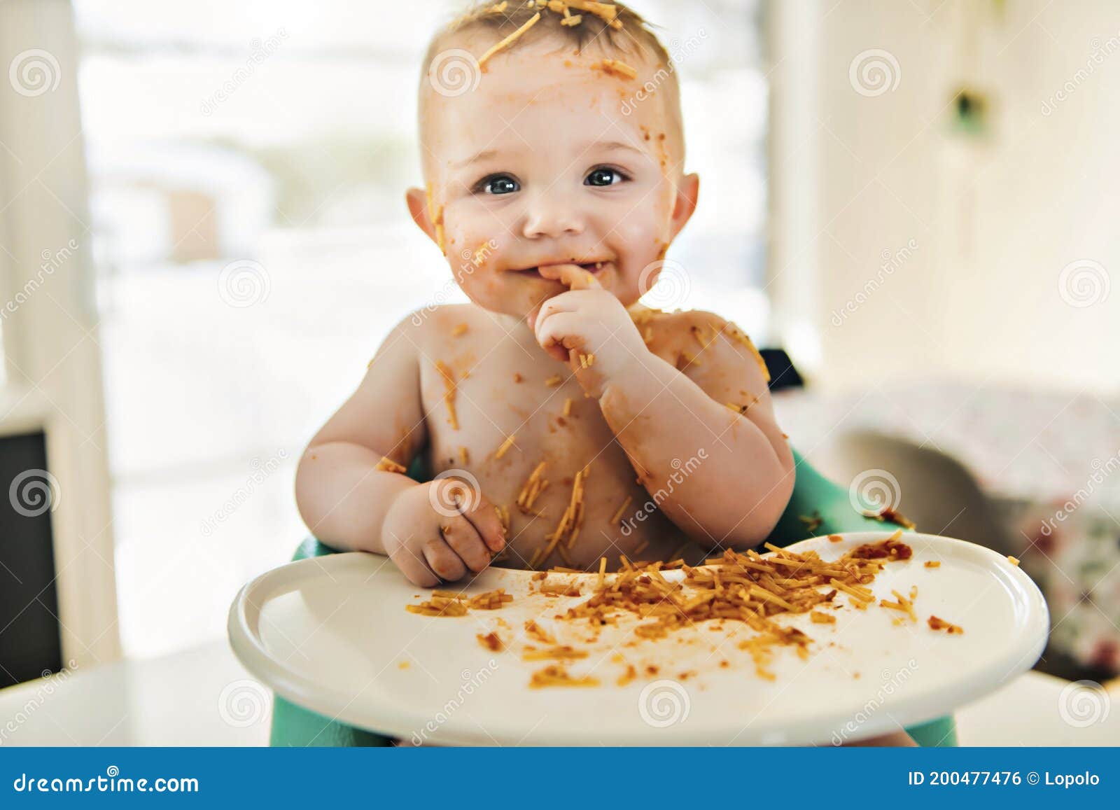 Little Baby Boy Eating Her Dinner and Making a Mess Stock Photo - Image ...