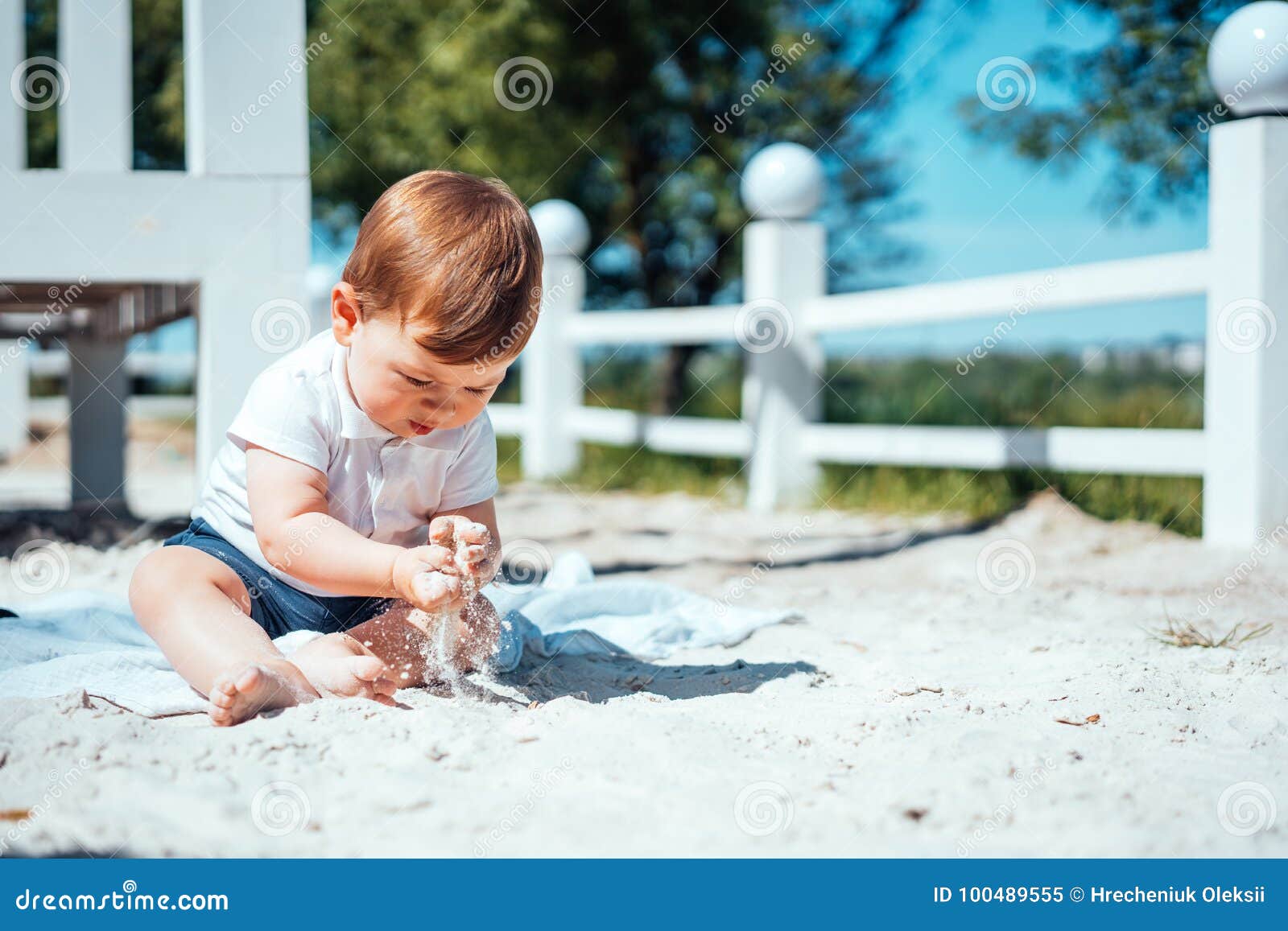 Little Baby Boy Sitting on the Sand Stock Image - Image of child, hair ...