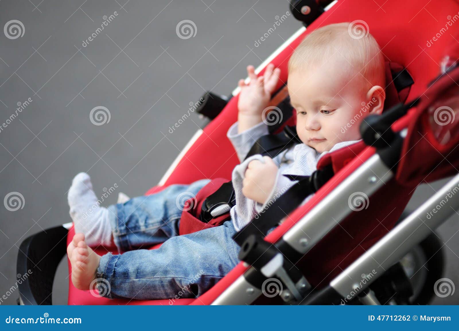Little Baby Boy in Stroller Stock Photo - Image of foot, face: 47712262