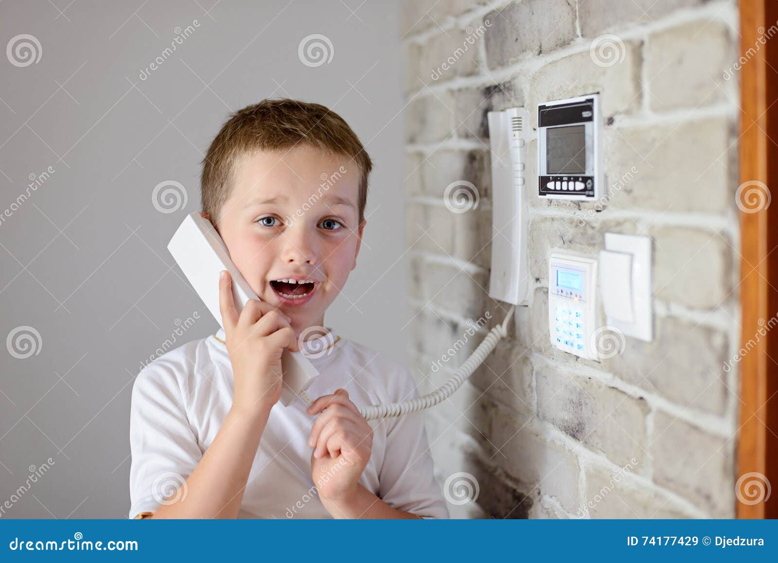 Little Baby Boy Talking on Intercom Stock Image - Image of building ...