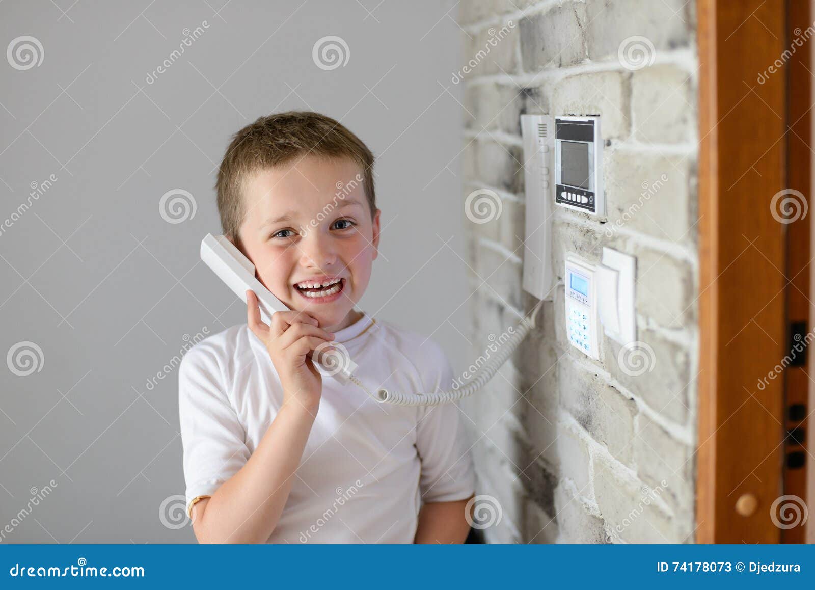 Little Baby Boy Talking on Intercom Stock Image - Image of door, entry ...